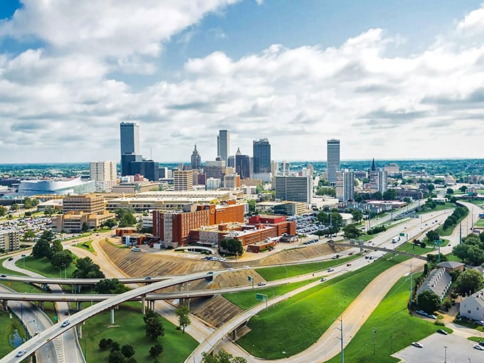 Highways curve like arteries around Tulsa's heart, proving that even infrastructure can have a certain poetic quality from above.