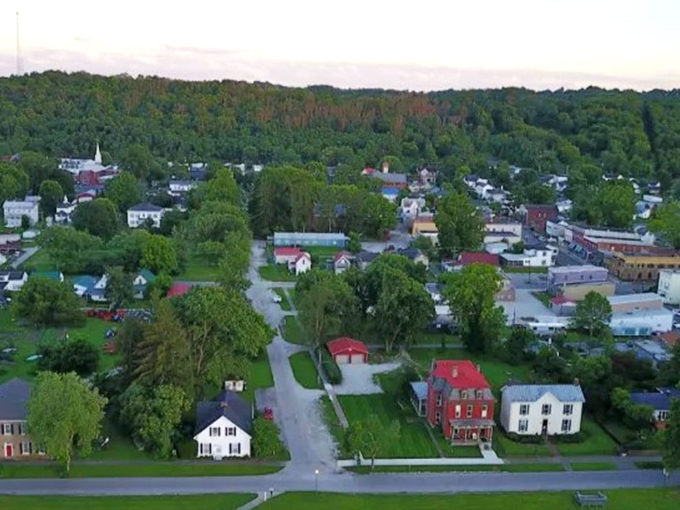 From above, Augusta reveals its perfect layout—a patchwork of historic homes, church steeples, and tree-lined streets embraced by rolling hills.