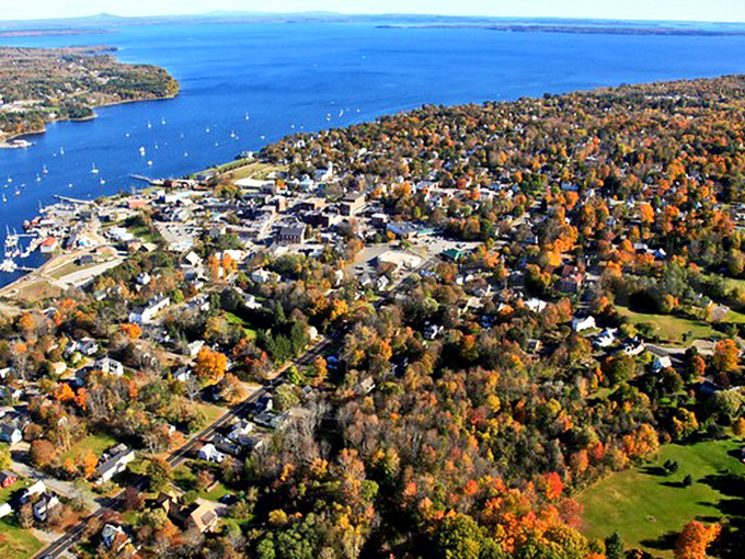 Belfast unfurls its autumn splendor in this aerial view, where forest meets harbor in a patchwork quilt of nature's finest colors.