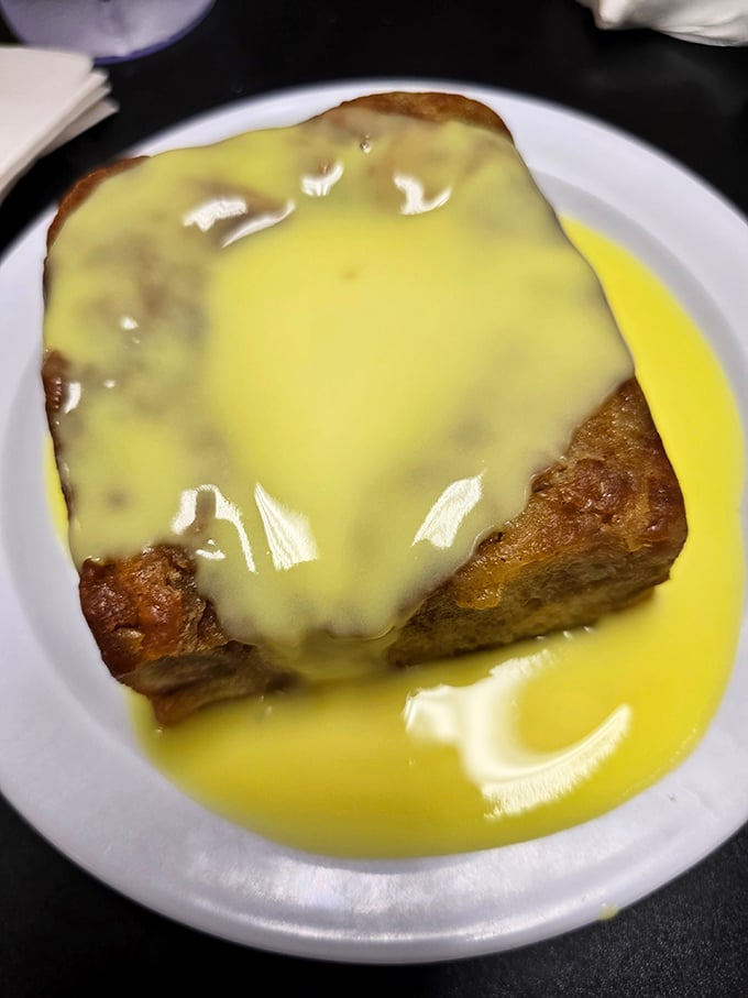 Bread pudding swimming in custard sauce that would make angels weep. Dessert isn't just an option here&mdash;it's practically mandatory.