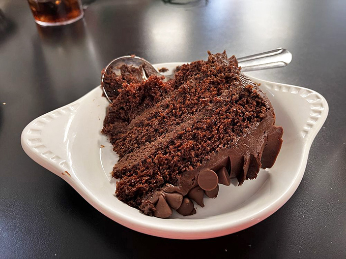 A slice of chocolate cake so rich and moist it makes you question why we don't eat dessert first. Life's short; start with the good stuff.