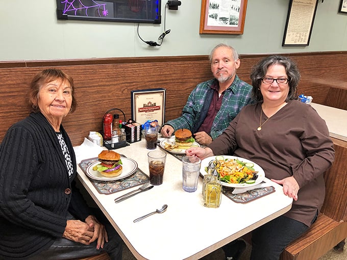 Happy diners sharing a moment over good food. This is what restaurants are really about &ndash; bringing people together around a table.