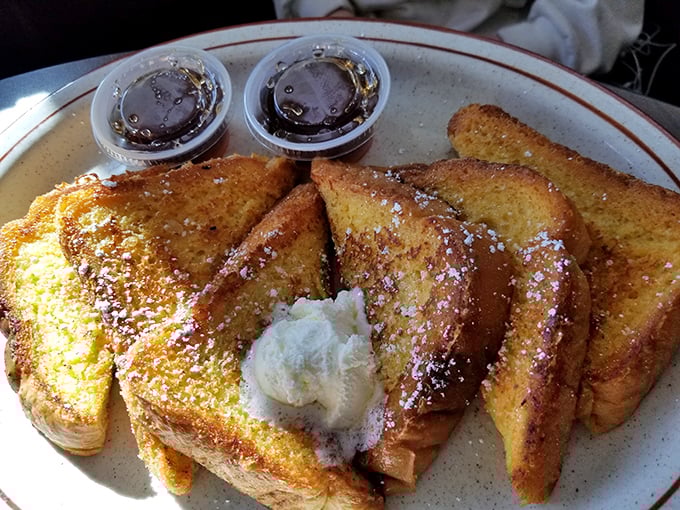 French toast that's achieved the golden ratio of crispy exterior to custardy interior – breakfast that doubles as dessert without apology.
