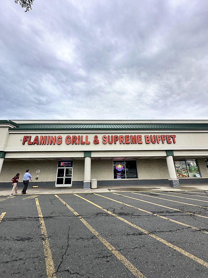 Even under cloudy skies, this unassuming exterior beckons food enthusiasts. Don't judge a buffet by its strip mall cover.