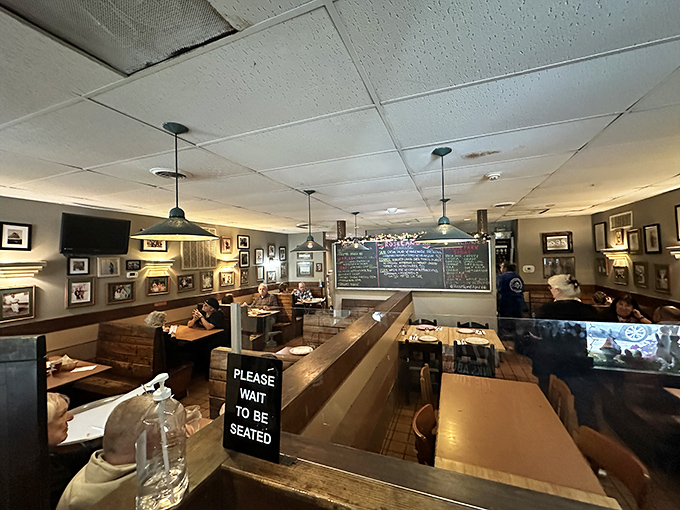 The dining room buzzes with anticipation and satisfaction. Every table tells a story of pizza pilgrimages rewarded with exceptional flavor.