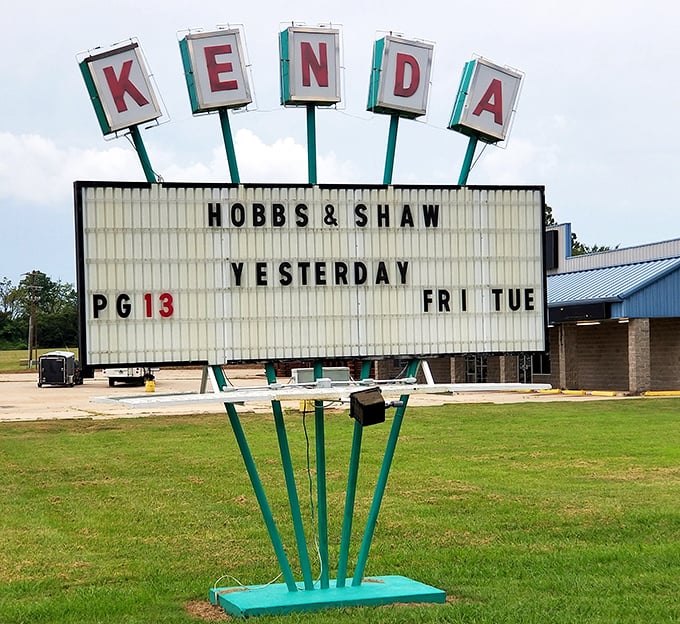 The vintage marquee announces upcoming features with retro charm, its distinctive lettering visible from the highway like a beacon to movie lovers.