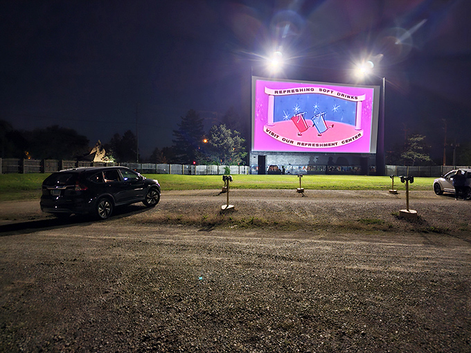 As night embraces the drive-in, the illuminated screen becomes the brightest star in McHenry's evening sky.