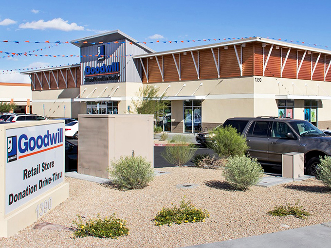 Blue skies and bargains await. The Henderson Goodwill stands like a retail oasis amid the xeriscaped landscape of American Pacific Drive.