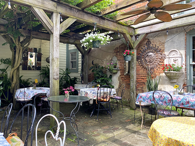 Outdoor dining under a rustic pergola, where floral tablecloths dance in the breeze and every meal feels like a special occasion.