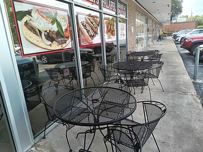 Outdoor seating for those perfect Missouri spring and fall days. The window displays showcase exactly what you're in for&mdash;generous portions of comfort food classics.