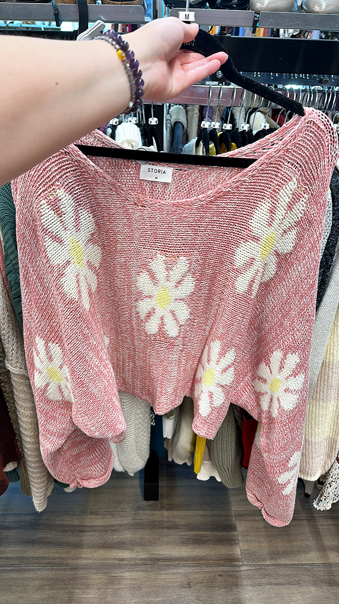 Cozy knits with personality to spare. This daisy-adorned sweater proves that "pre-loved" doesn't mean "past its prime" in the fashion lifecycle.