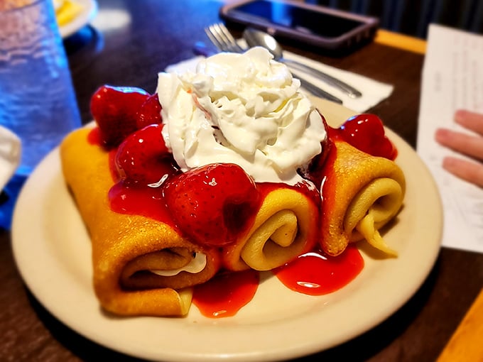 Crepes filled with sweet treasures and topped with whipped cream. These delicate pancake cousins dress up for the occasion with berry compote.