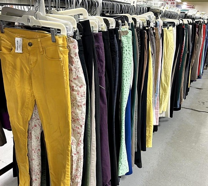 A rainbow of denim possibilities hanging in perfect formation. Those yellow pants are practically guaranteed to make you the most visible person at Kroger.