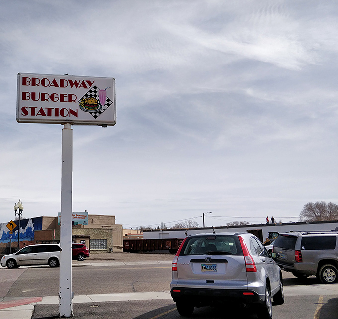 The roadside sign stands as a beacon for hungry travelers, promising salvation from fast-food mediocrity.