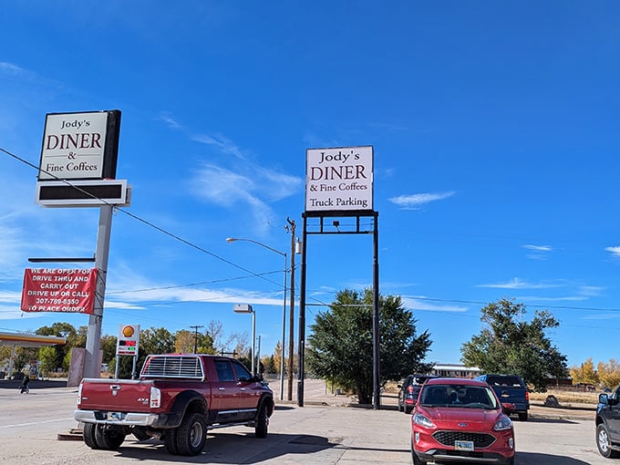 The parking lot tells the story – pickup trucks and family cars gathered like modern-day horses at an old-fashioned watering hole.