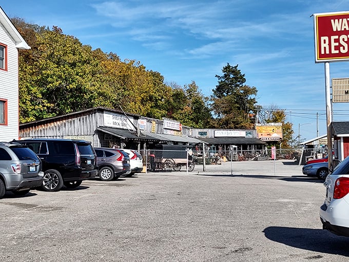 The view from the parking lot reveals neighboring shops, creating that classic small-town strip where the restaurant serves as a community anchor.