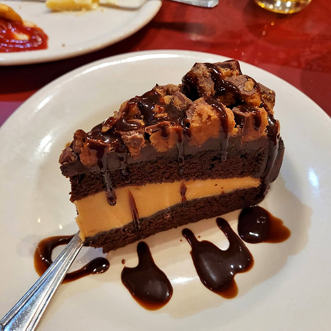 This isn't just dessert, it's architecture &ndash; layers of chocolate and peanut butter creating a skyscraper of sweetness worth every calorie.