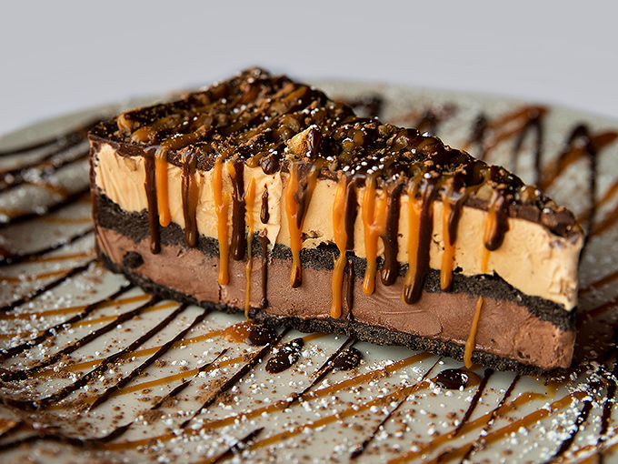 Dessert architecture that deserves its own blueprint. Layers of chocolate and caramel creating a sweet skyline you'll dream about for weeks.