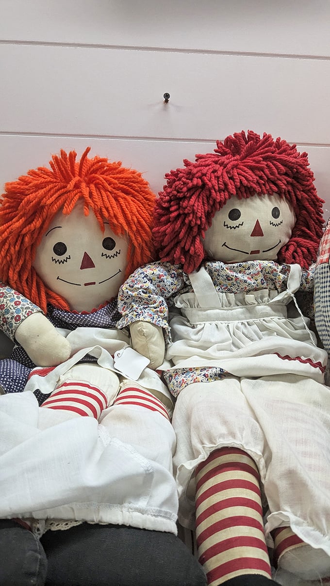Raggedy Ann and Andy dolls caught mid-gossip. They've seen things in this store that would make your vintage Barbie blush.