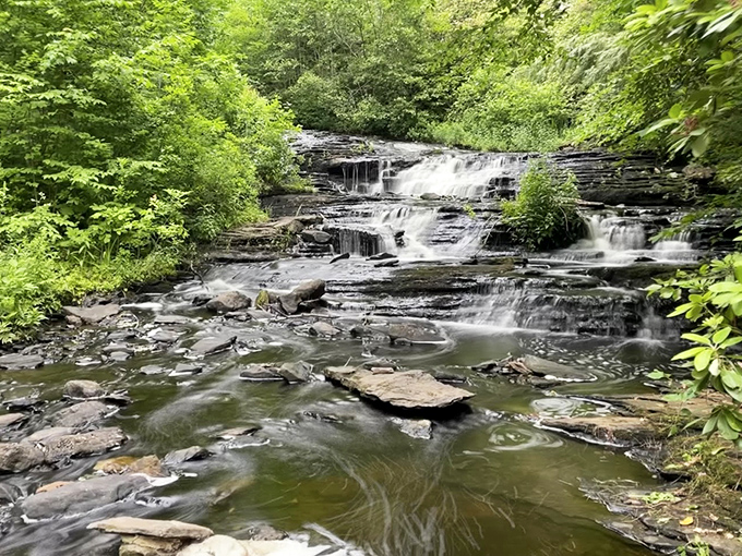 Water cascading over ancient rocks creates nature's version of a sound machine. No batteries required, satisfaction absolutely guaranteed.