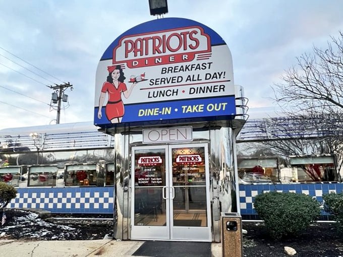 Rain or shine, that iconic Patriots Diner sign beckons hungry travelers like a lighthouse for the breakfast-starved. The promise of "Breakfast Served All Day" feels like poetry.