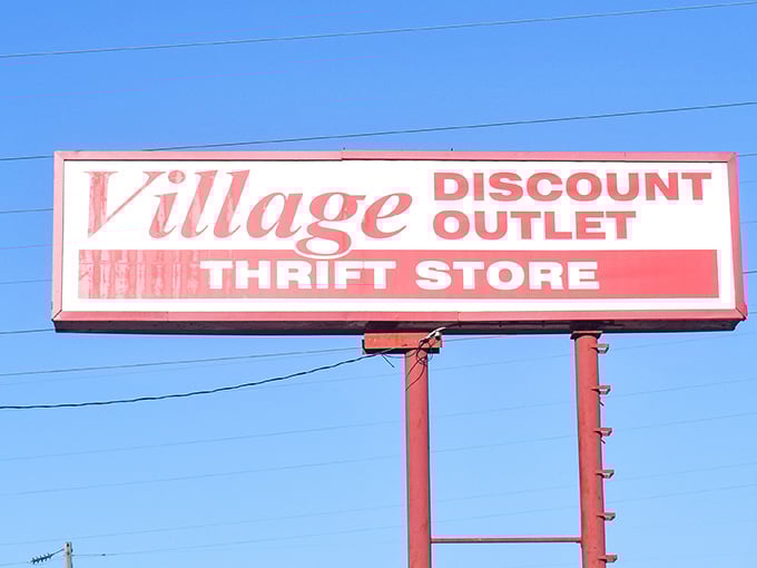 The roadside sign stands tall against the Indiana sky, a red rectangle of promise that whispers, "Yes, your next favorite outfit is waiting inside."