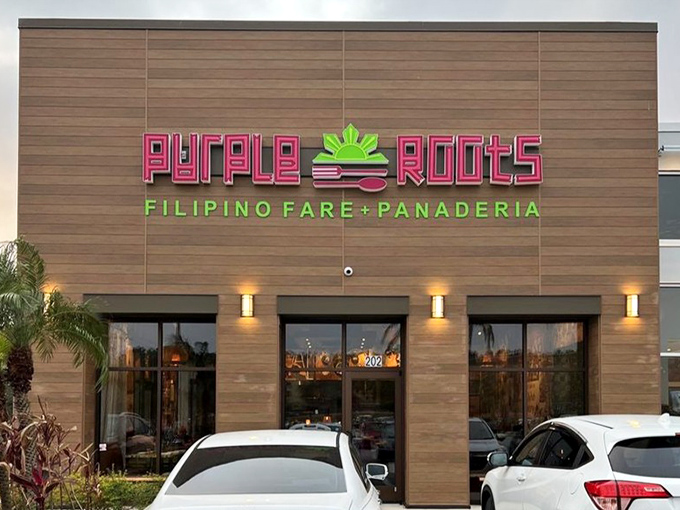 By night, the illuminated sign transforms into a purple-hued North Star guiding hungry travelers to Filipino flavor paradise.