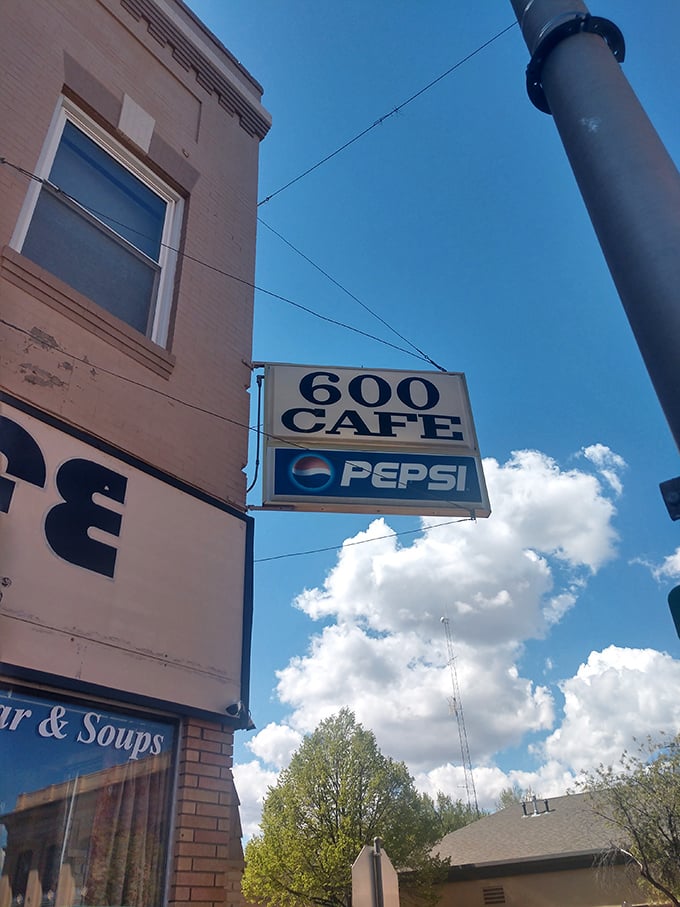 That classic sign against a big Montana sky &ndash; a beacon for hungry travelers and locals alike, promising honest food without pretense.