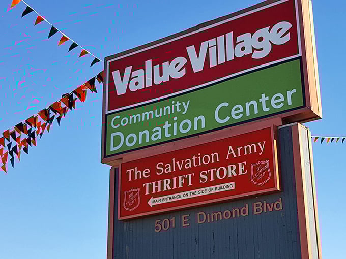 The roadside marquee announces this thrifting trifecta—Value Village, Community Donation Center, and Salvation Army—a holy trinity of secondhand salvation.