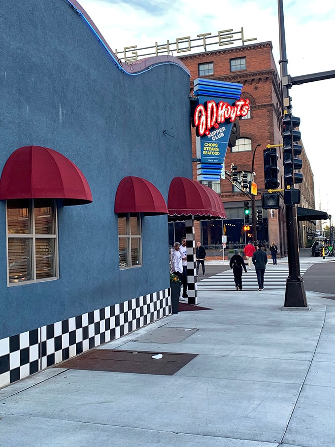 The neon sign glows like a North Star for hungry travelers. That distinctive blue exterior has guided food pilgrims for decades.
