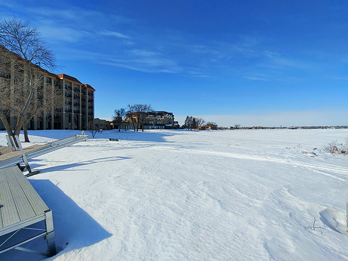 Winter transforms Lake Bemidji into a vast white playground where the frozen surface hosts everything from ice fishing to impromptu hockey games.