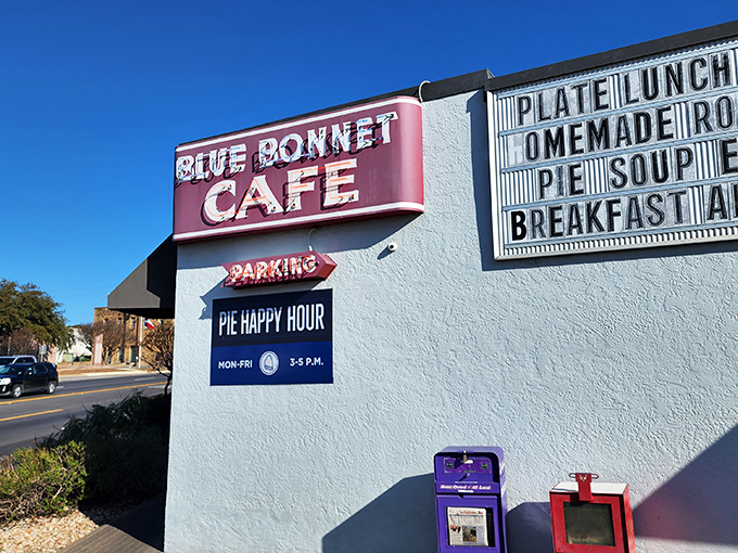 That classic red sign promises pie happiness, and those white walls have witnessed decades of satisfied breakfast lovers.