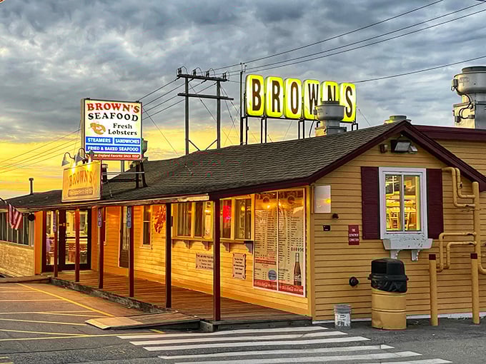 Brown's Lobster Pound glows like a seafood beacon at sunset, promising lobster treasures within those humble yellow walls.