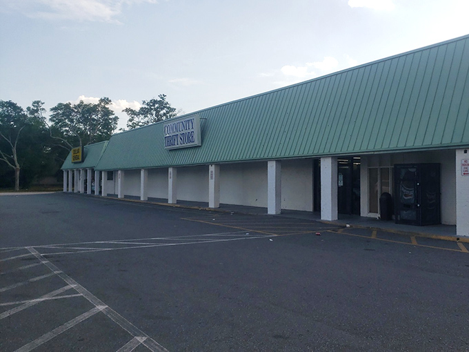 The unassuming exterior of Community Thrift Store hides a treasure trove of furniture finds waiting to transform your home.