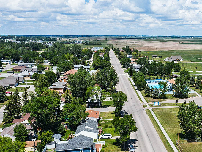 Aerial view of Devils Lake shows tree-lined streets and wide-open spaces where stress doesn't stand a chance.