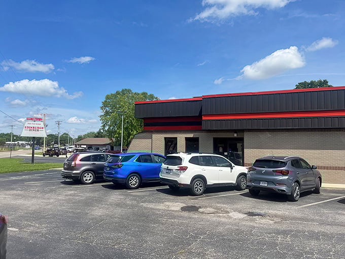 Edinburgh Diner's modest exterior hides a tenderloin treasure inside. The red trim hints at the flavor explosion waiting beyond those doors.