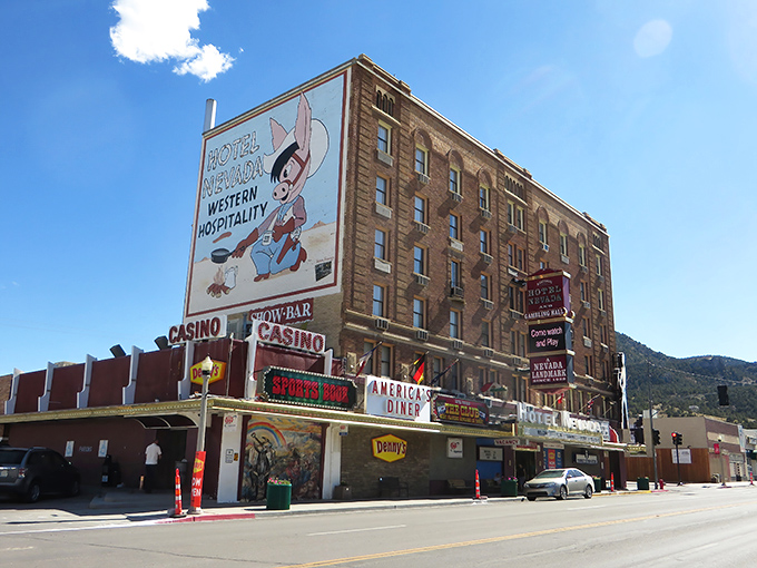 Hotel Nevada stands tall in Ely's skyline, a six-story time capsule where western hospitality meets small-town charm. The cowboy mascot promises good times ahead!