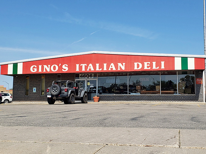 Gino's Italian Deli stands proud with its red awning and Italian flag colors. A simple storefront hiding sandwich greatness within.