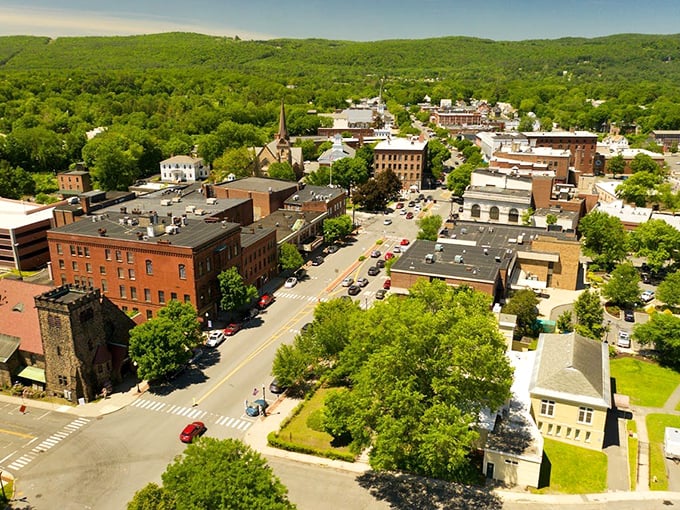 Greenfield's downtown vista &ndash; where brick buildings and green mountains create the perfect small-town symphony.