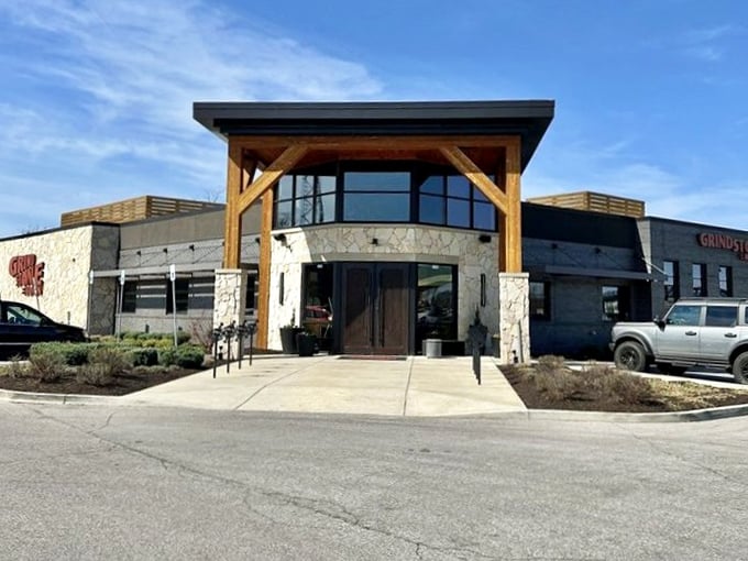 The stone and timber exterior of Grindstone on the Monon promises comfort food with a modern twist.