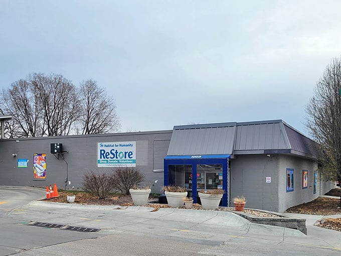 The unassuming exterior of Habitat ReStore hides a treasure trove of furniture finds waiting to transform your home without breaking the bank.
