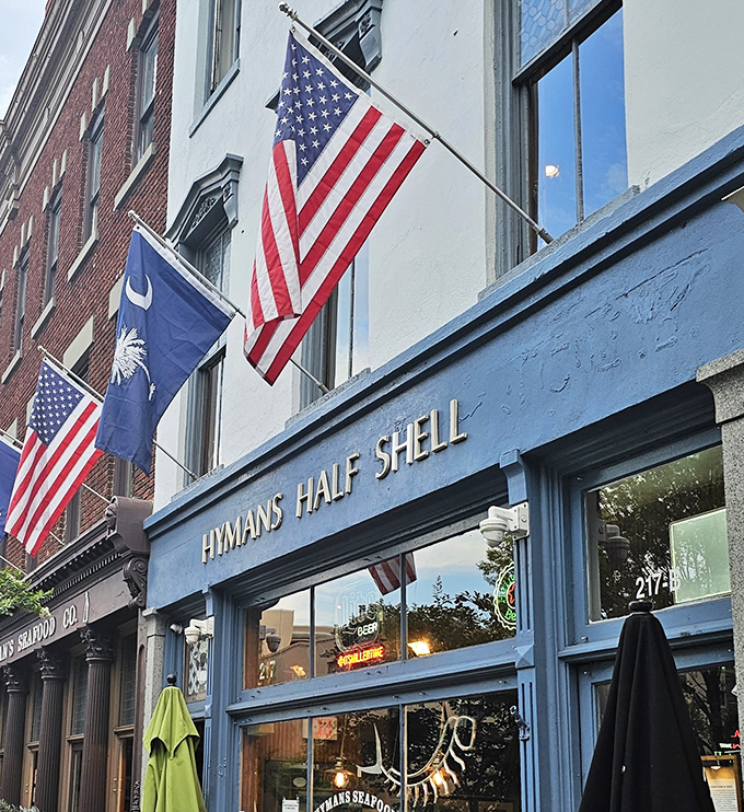 Hyman's Seafood's iconic blue storefront proudly flies the American and South Carolina flags, welcoming hungry seafood lovers to a Charleston institution.