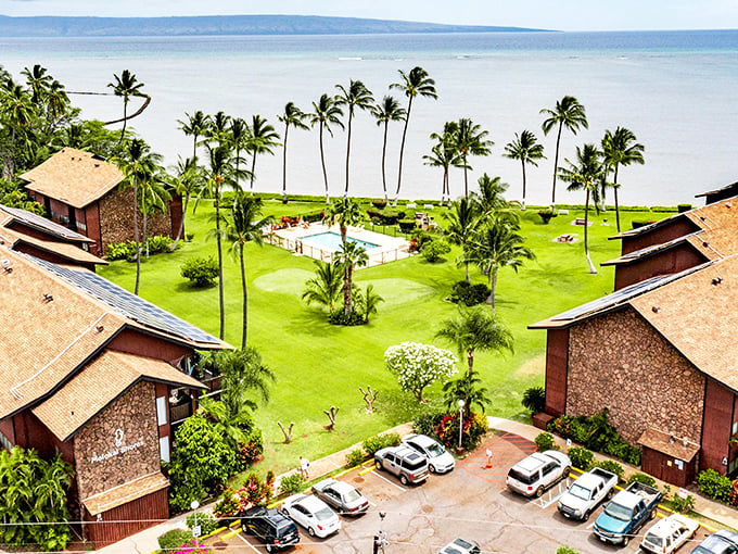 Palm trees stand like sentinels around this Molokai resort, where the ocean stretches endlessly toward Maui. Paradise doesn't need a passport!
