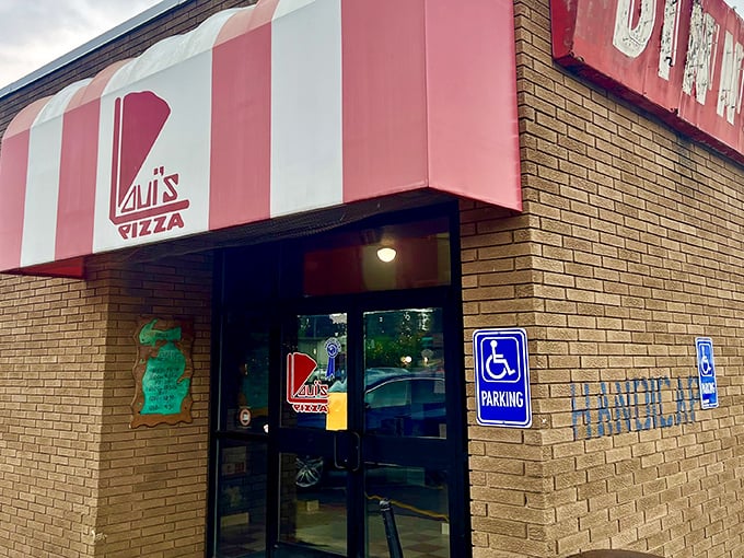 The iconic red and white striped awning of Loui's Pizza &ndash; a beacon of hope for hungry Detroit-style pizza lovers.