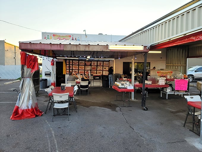Lupita's outdoor setup is like finding a secret clubhouse where the password is "one Sonoran dog, please." Simple tables, extraordinary flavors.
