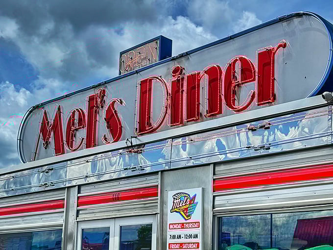 That classic silver exterior with bold red lettering isn't just a sign—it's a time machine disguised as a diner. Welcome to Mel's!