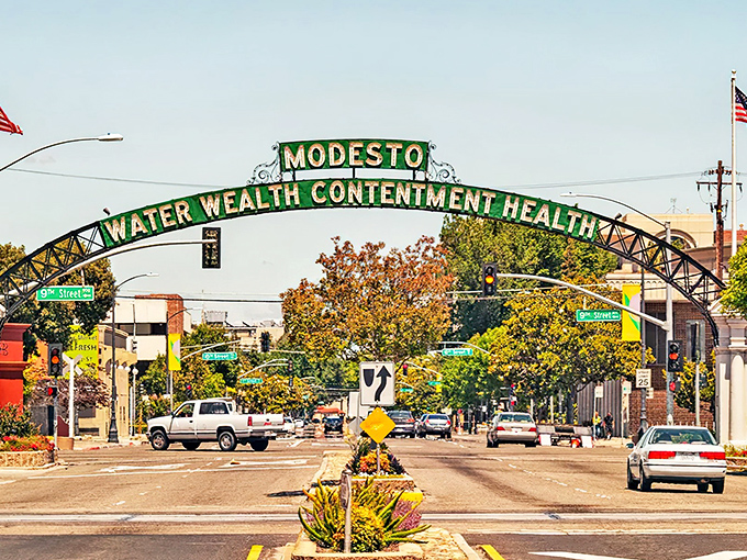 Modesto's iconic arch welcomes visitors with a promise of "Water, Wealth, Contentment, Health" &ndash; retirement goals in four simple words!