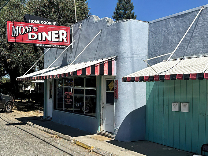Mom's Diner's classic red sign promises "HOME COOKIN'" – and boy, does it deliver on that promise!