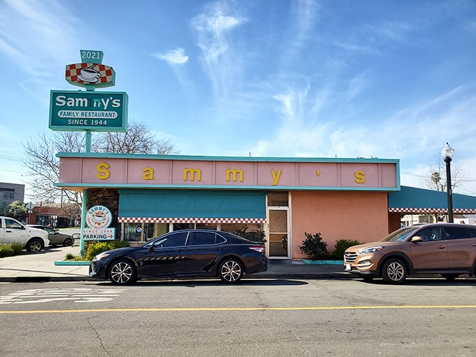 The pink and turquoise facade of Sammy's is like finding a portal to 1950s America. Checkered trim included!