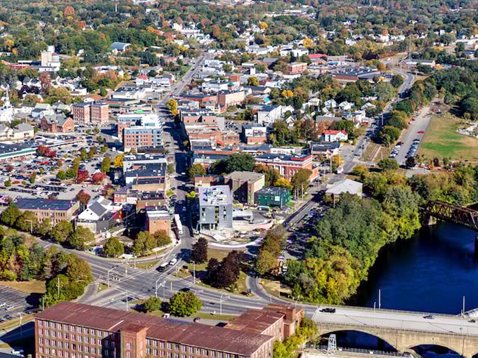 Waterville's aerial view showcases its riverside charm and historic downtown &ndash; Maine's best-kept affordable secret!